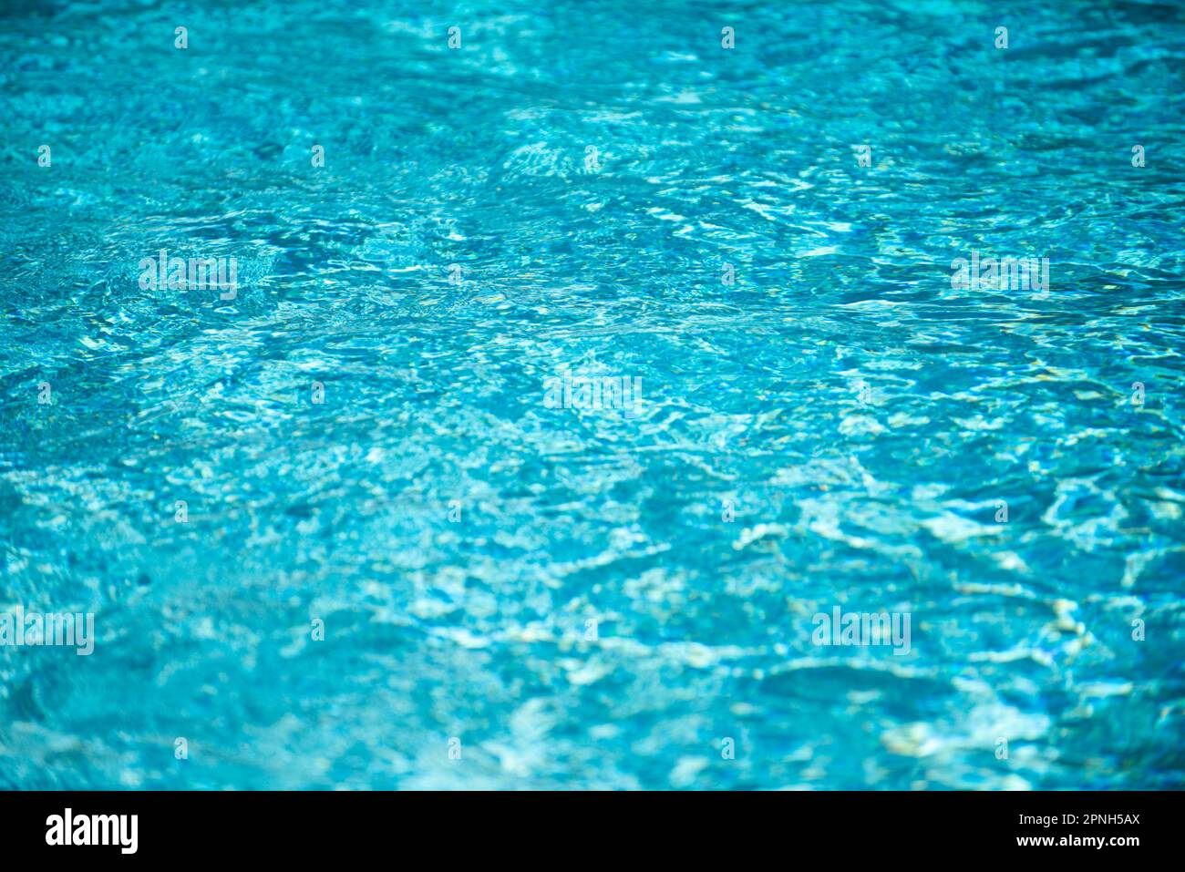 Water in swimming pool, background with high resolution. Wave abstract or rippled water texture ...