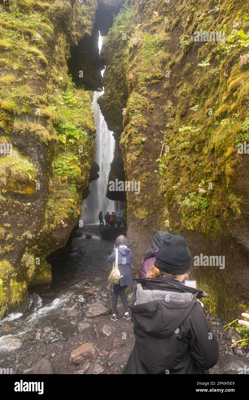Gljufrabui, Iceland- August 2021: tourist entering Gljufrabui, a little ...