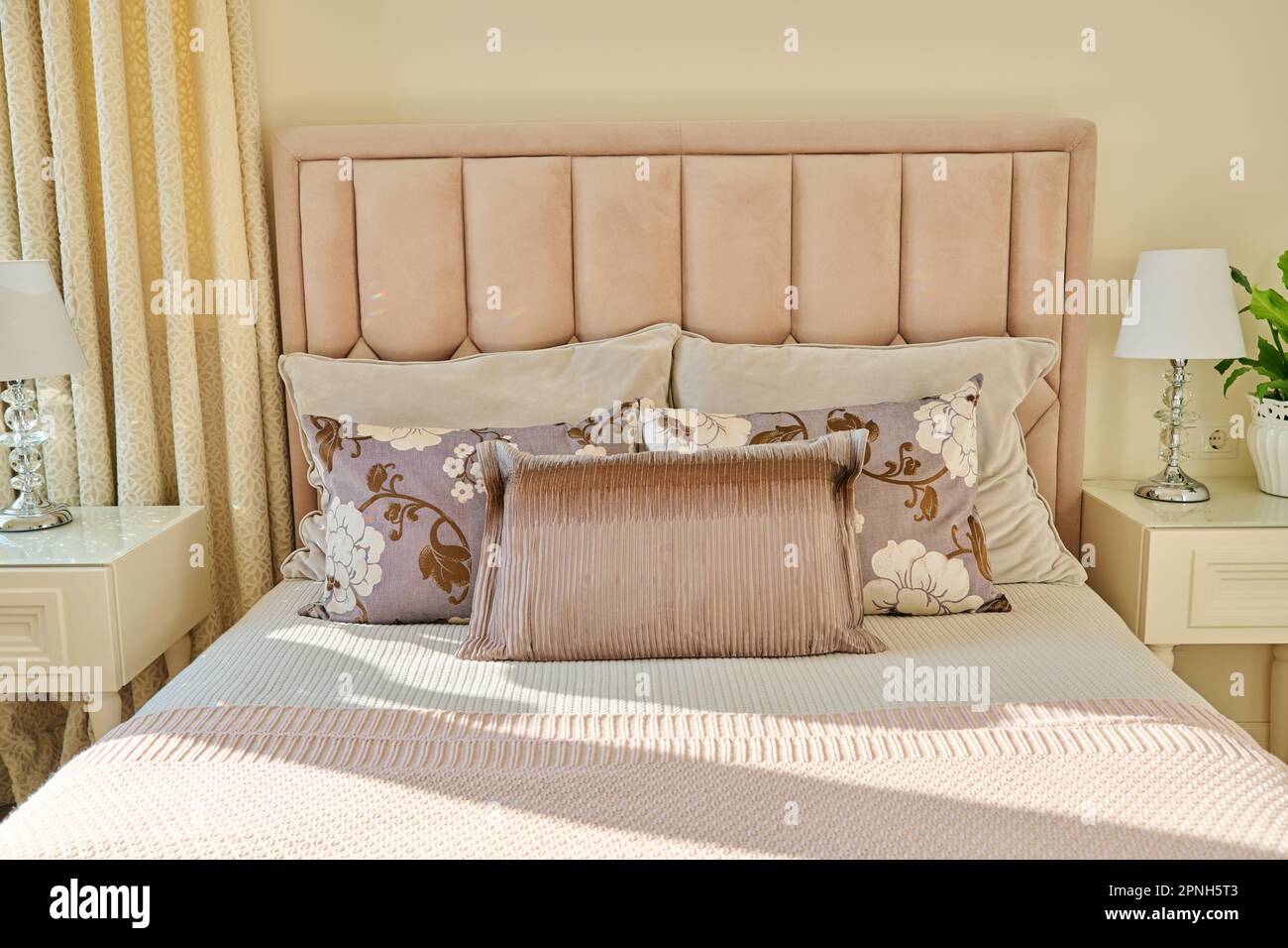 Classic bedroom interior in light ivory colors, in warm sunlight Stock ...