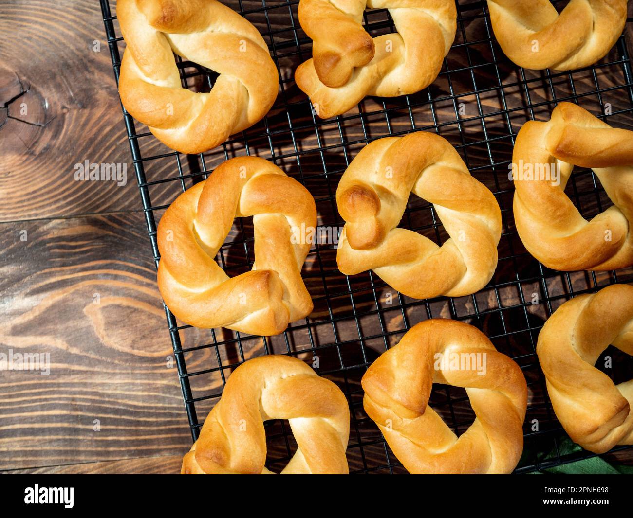 Taralli twist on wooden background. Typical italian ring-shaped or doughnut-shaped biscuit ...