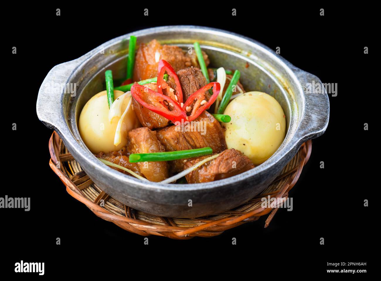 Vietnamese braised pork with boiled eggs in soy sauce for a menu Stock ...