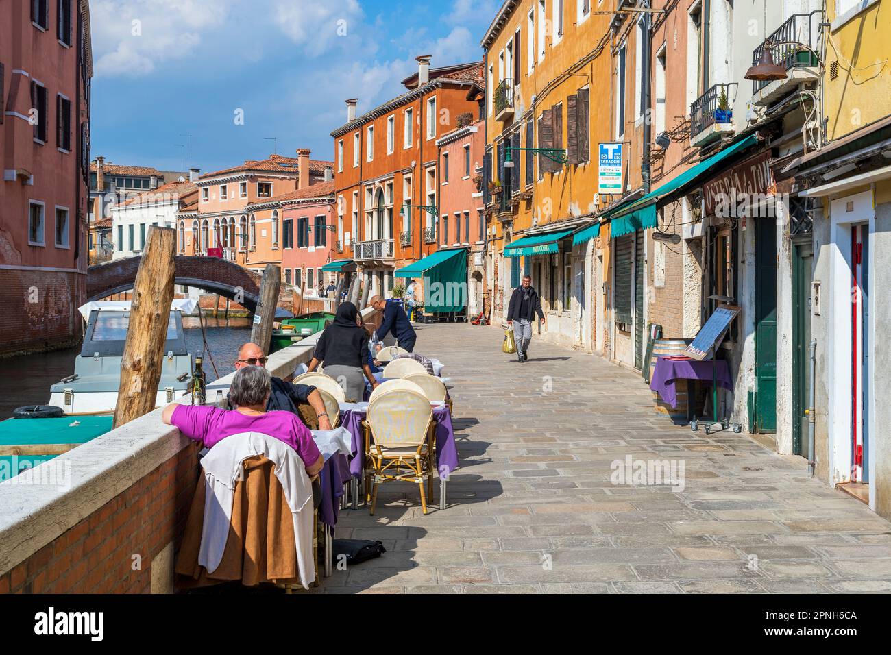 Scenic view of an outdoor cafe restaurant on a water canal, Venice ...