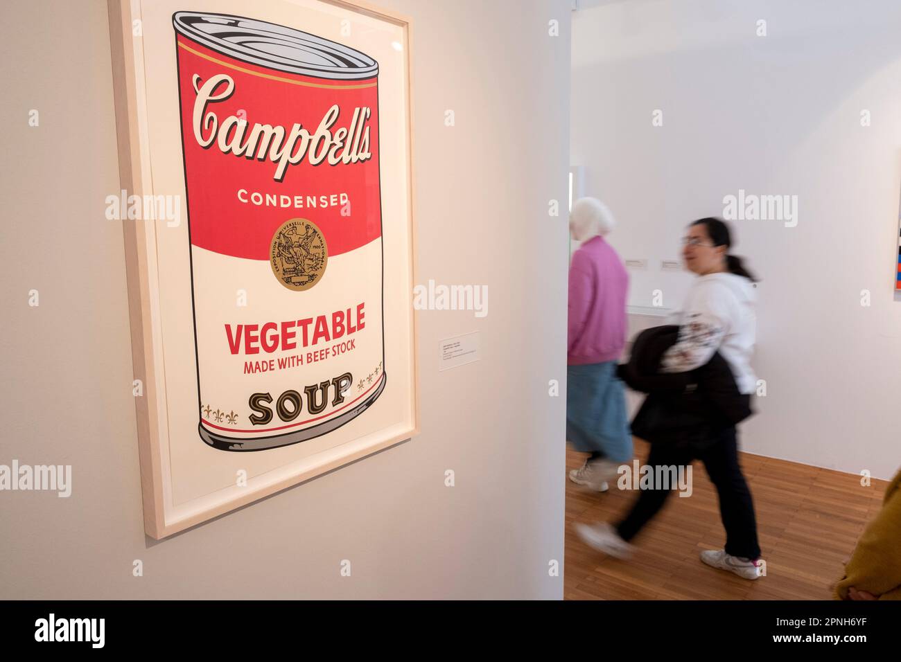 Visitors pass an Andy Warhol screen print of Campbells Soup - Vegetable ...