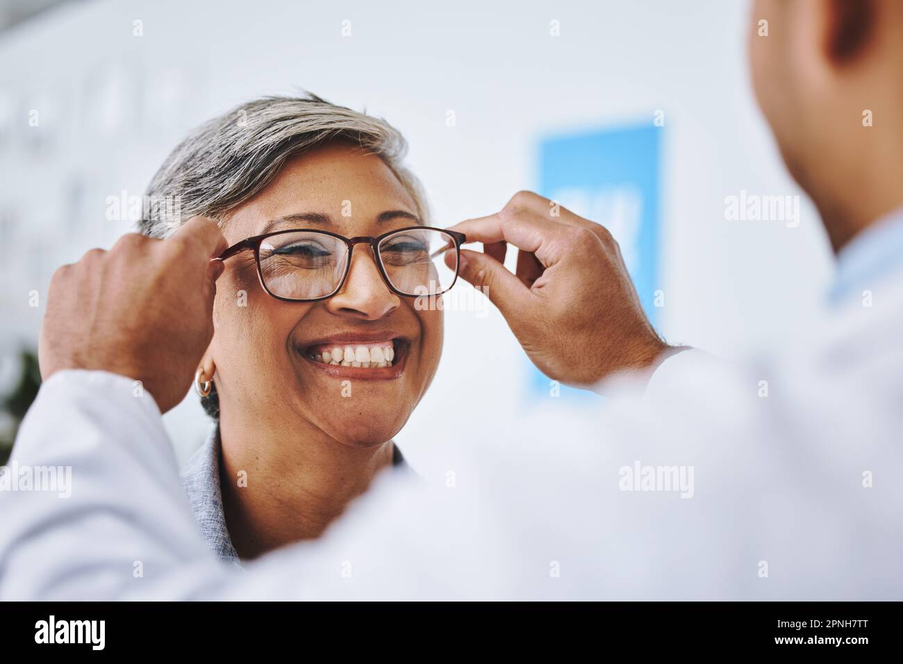 Optometry, smile and woman with prescription glasses, optician and ...