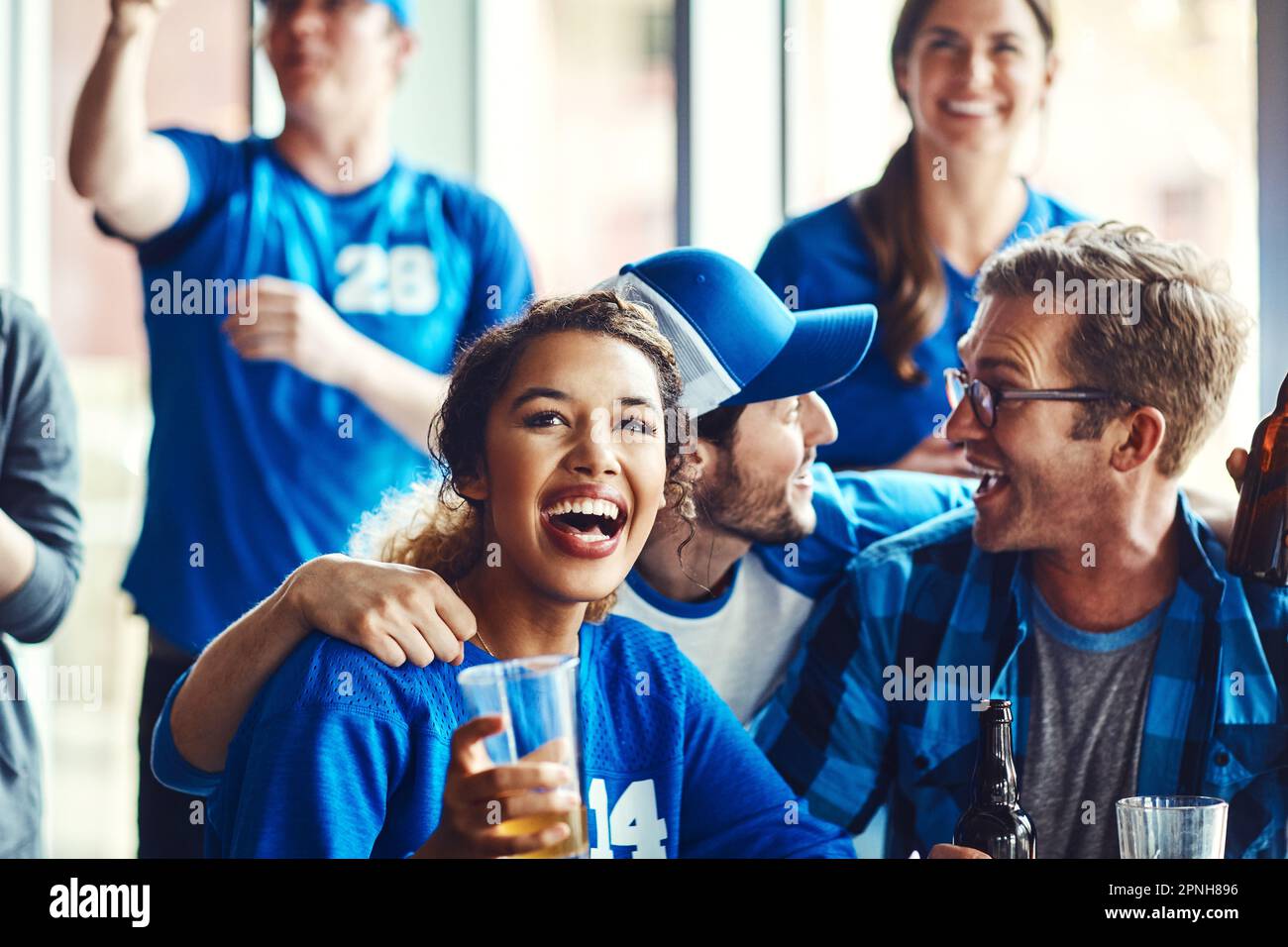 Woman surrounded by men in a bar hi-res stock photography and images ...