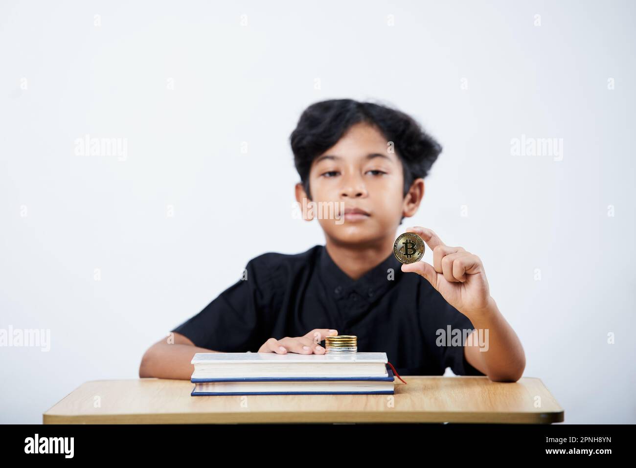 Smart Boy holding Crypto Bitcoin with isolated white background Stock ...