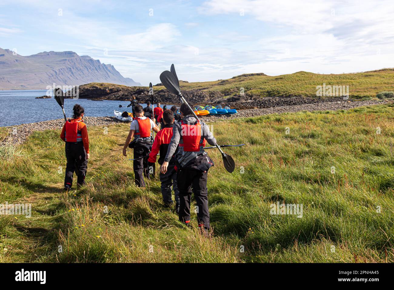 Iceland - August 2021: group of tourist doing kayak in the ocean in the ...