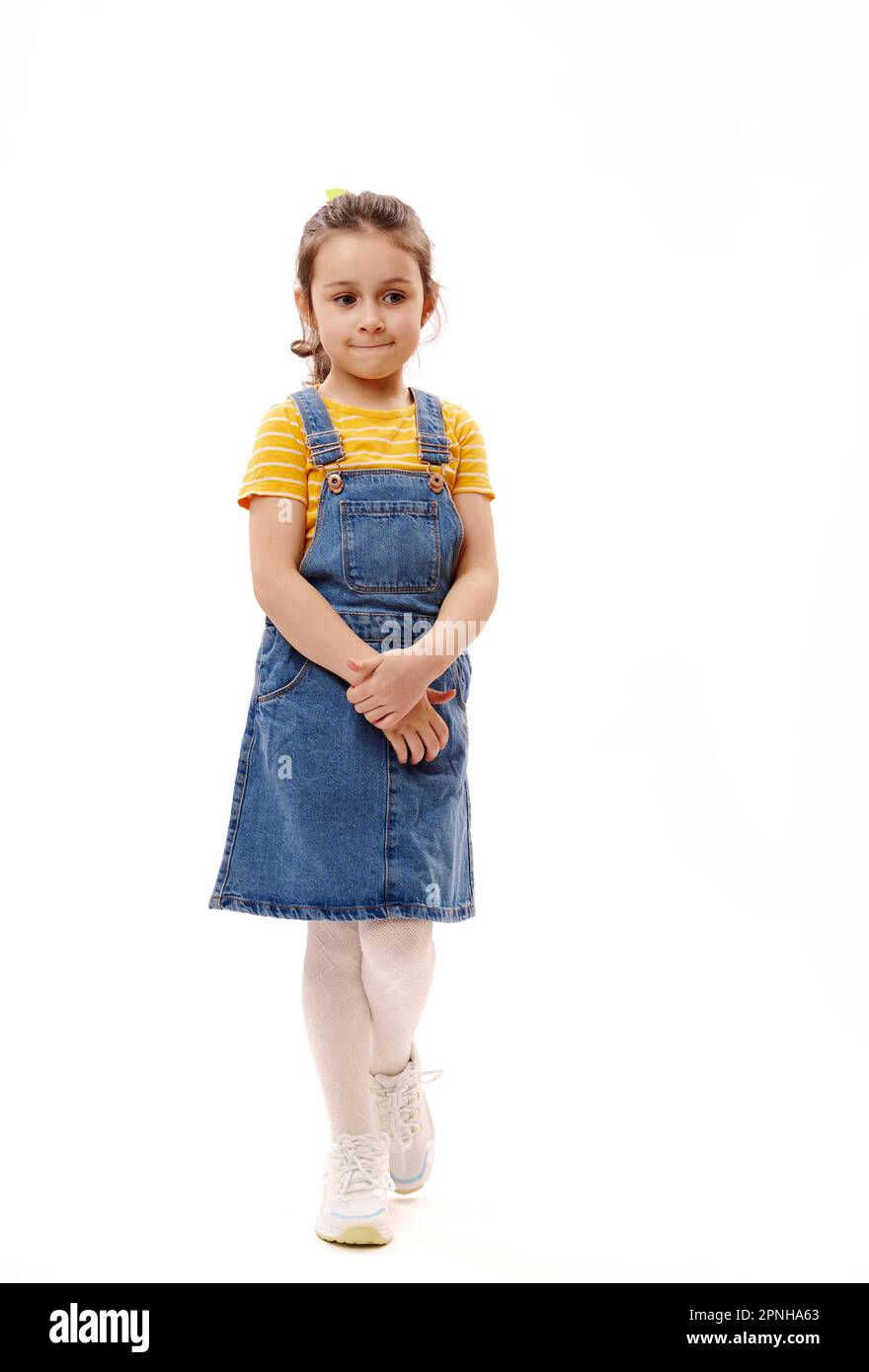 Full length vertical portrait of Caucasian lovely little preschooler ...