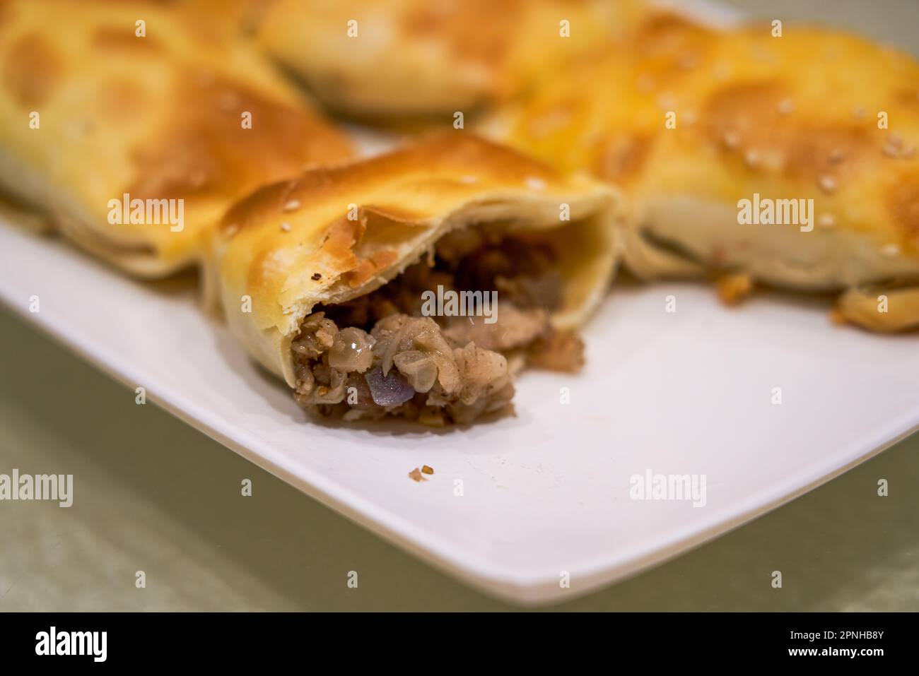 A delicious Chinese Xinjiang dish, baked buns Stock Photo - Alamy
