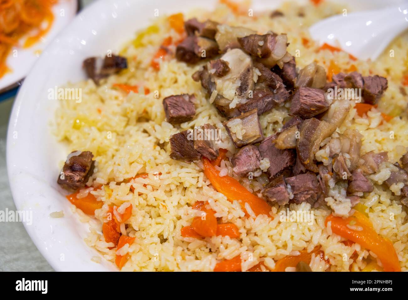 A delicious Chinese Xinjiang dish, mutton hand pilaf Stock Photo - Alamy