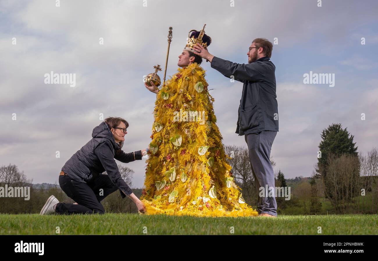Rupert North wearing a majestic robe created using an array of flowers ...