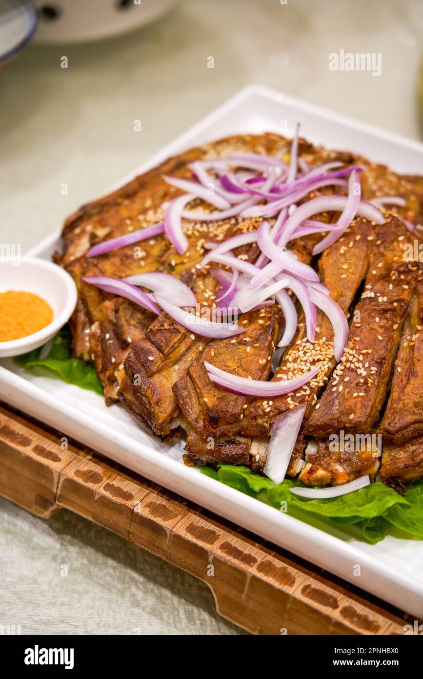 A delicious Chinese Xinjiang dish, grilled lamb chops Stock Photo - Alamy