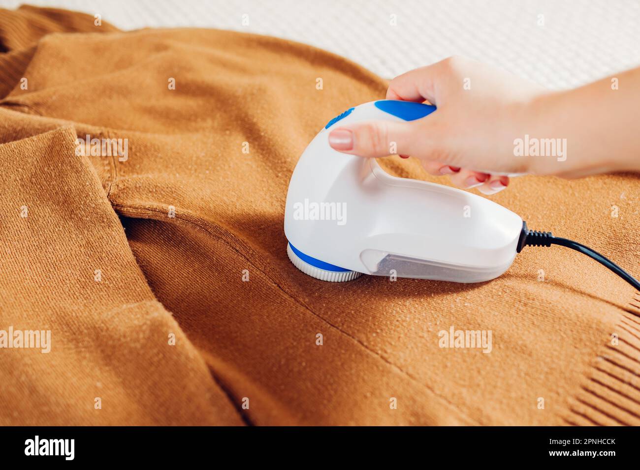 Woman removing her clothes hi-res stock photography and images - Alamy