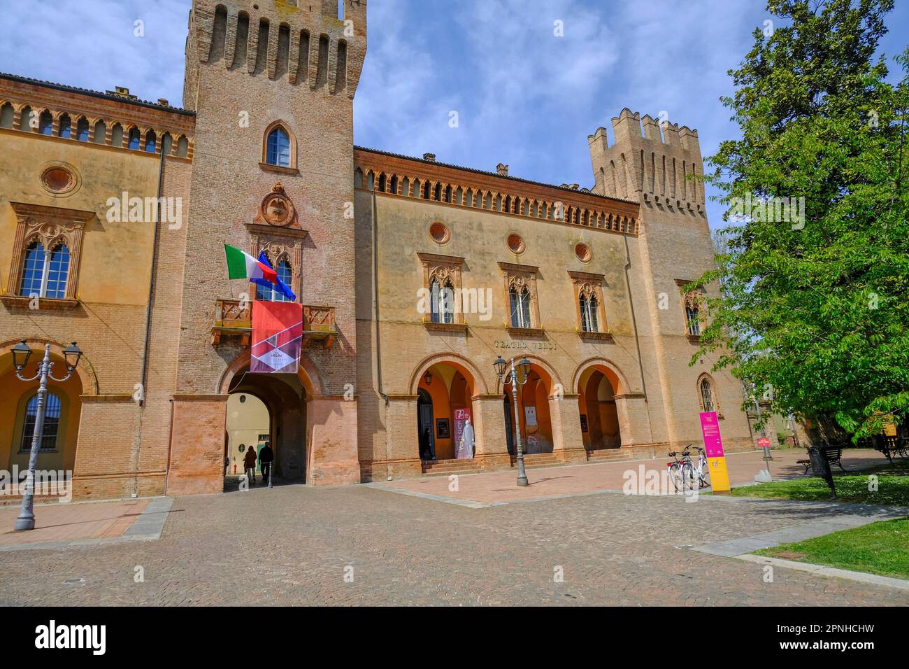 Building of theater Giuseppe Verdi with a tower in Busseto, Italy ...
