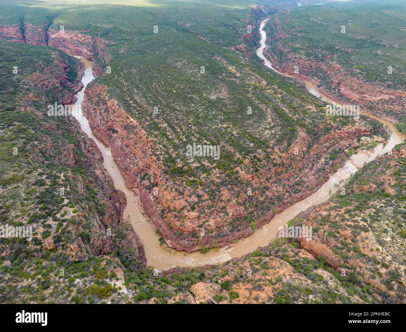 An aerial view of Murchison River flowing through a green canyon in ...