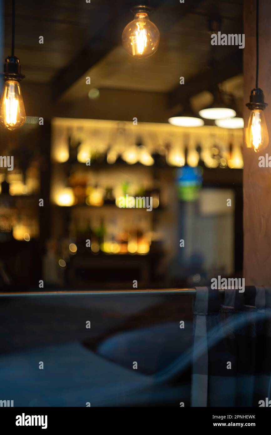 The back door of a restaurant is illuminated by a cluster of lights ...
