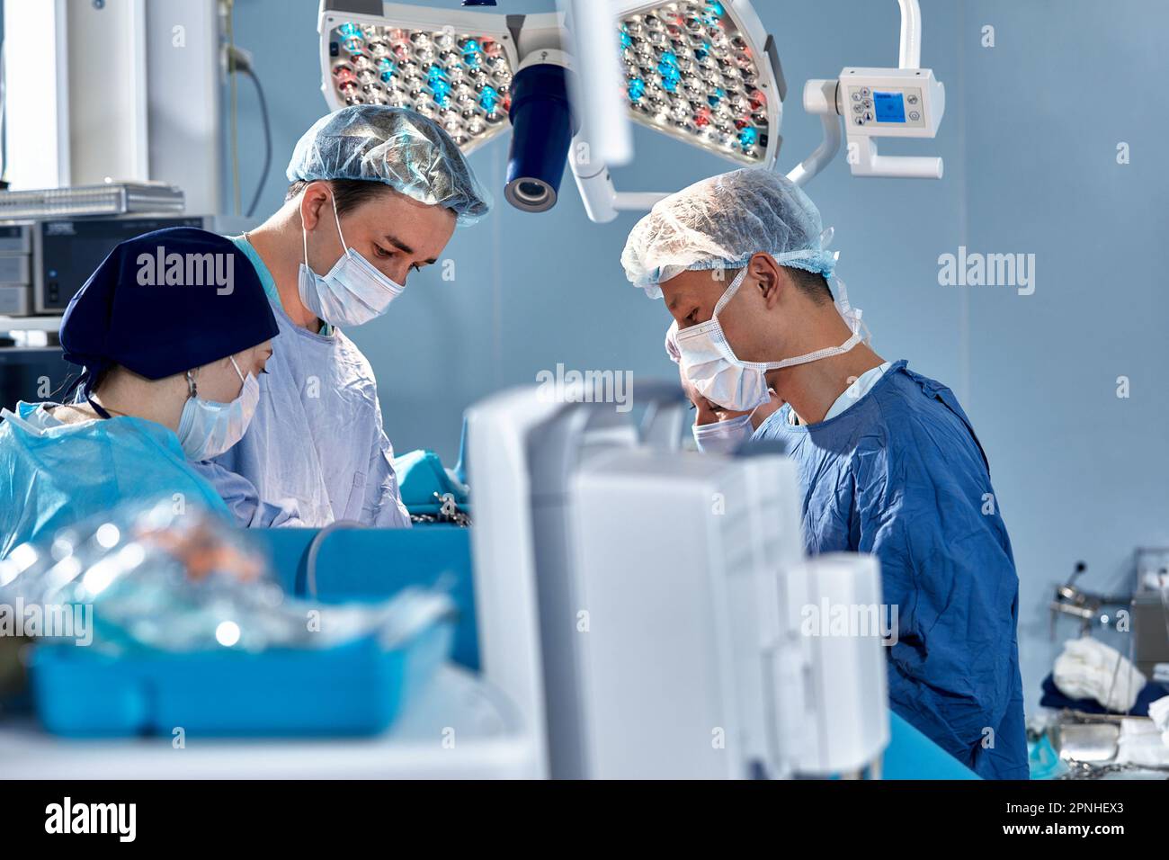 faces of surgeons in the operating room during the operation. Modern ...