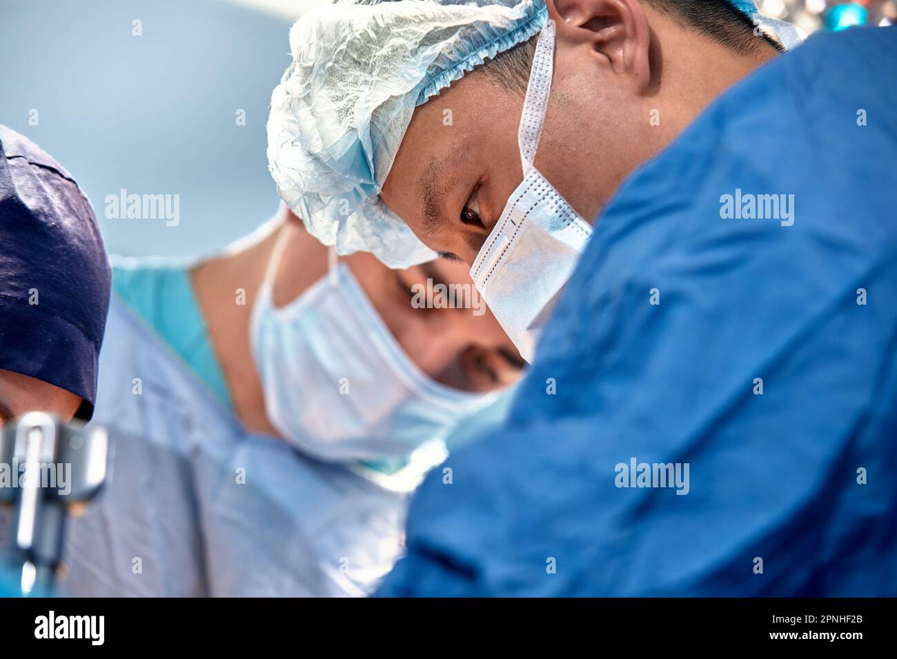faces of surgeons in the operating room during the operation. Modern ...