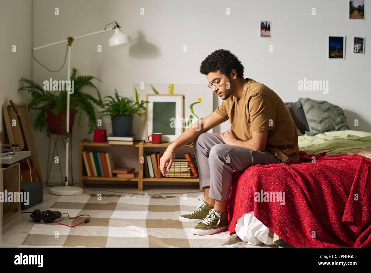 Teenage boy thinking about his problems in sad expression while sitting ...