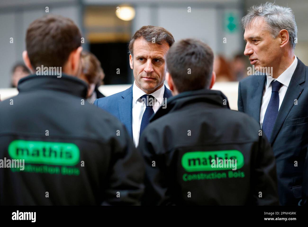 French President Emmanuel Macron, center, next to Mathis CEO Frank ...