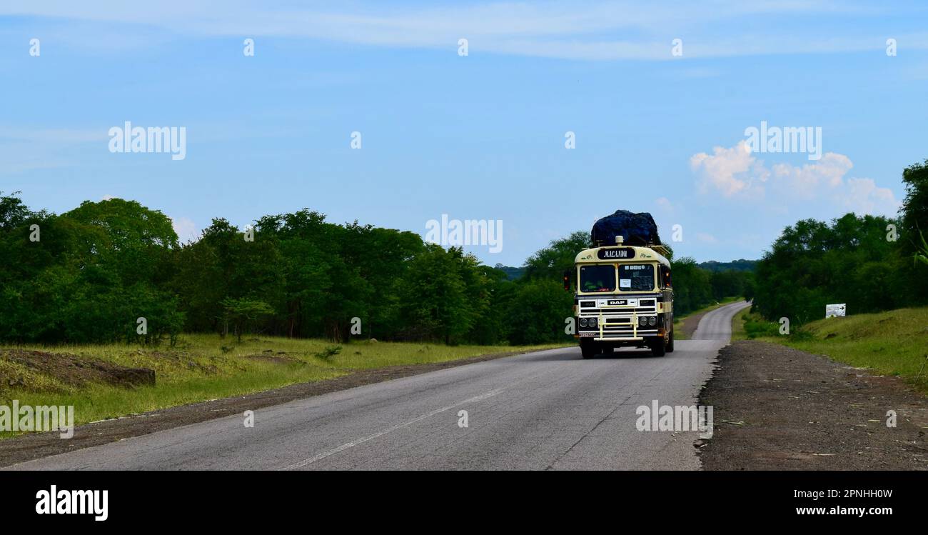 Loaded bus on a quiet road in Zimbabwe Stock Photo - Alamy