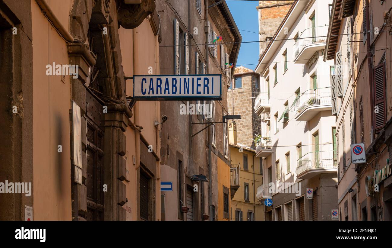 An Italian police station sign in Italian in a narrow street of Siena ...