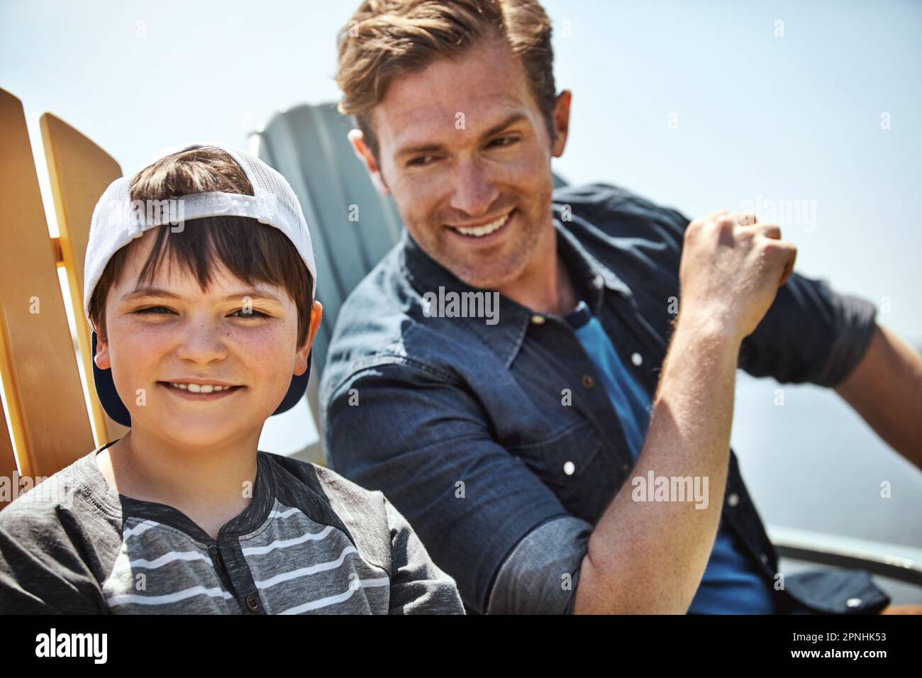 He loves being out and about with Dad. Portrait of a little boy bonding ...