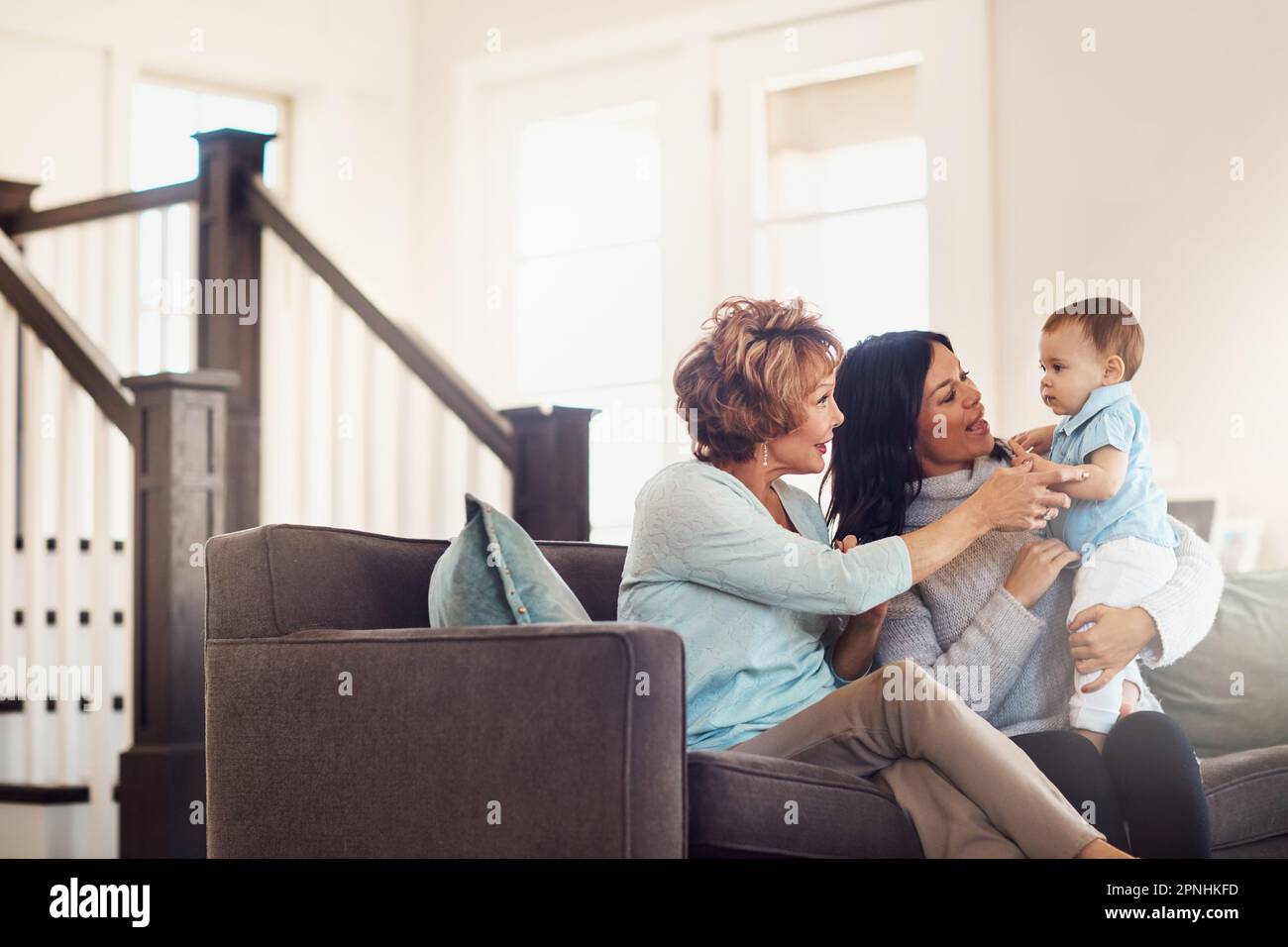 Three generations of happiness under one roof. an adorable baby girl ...