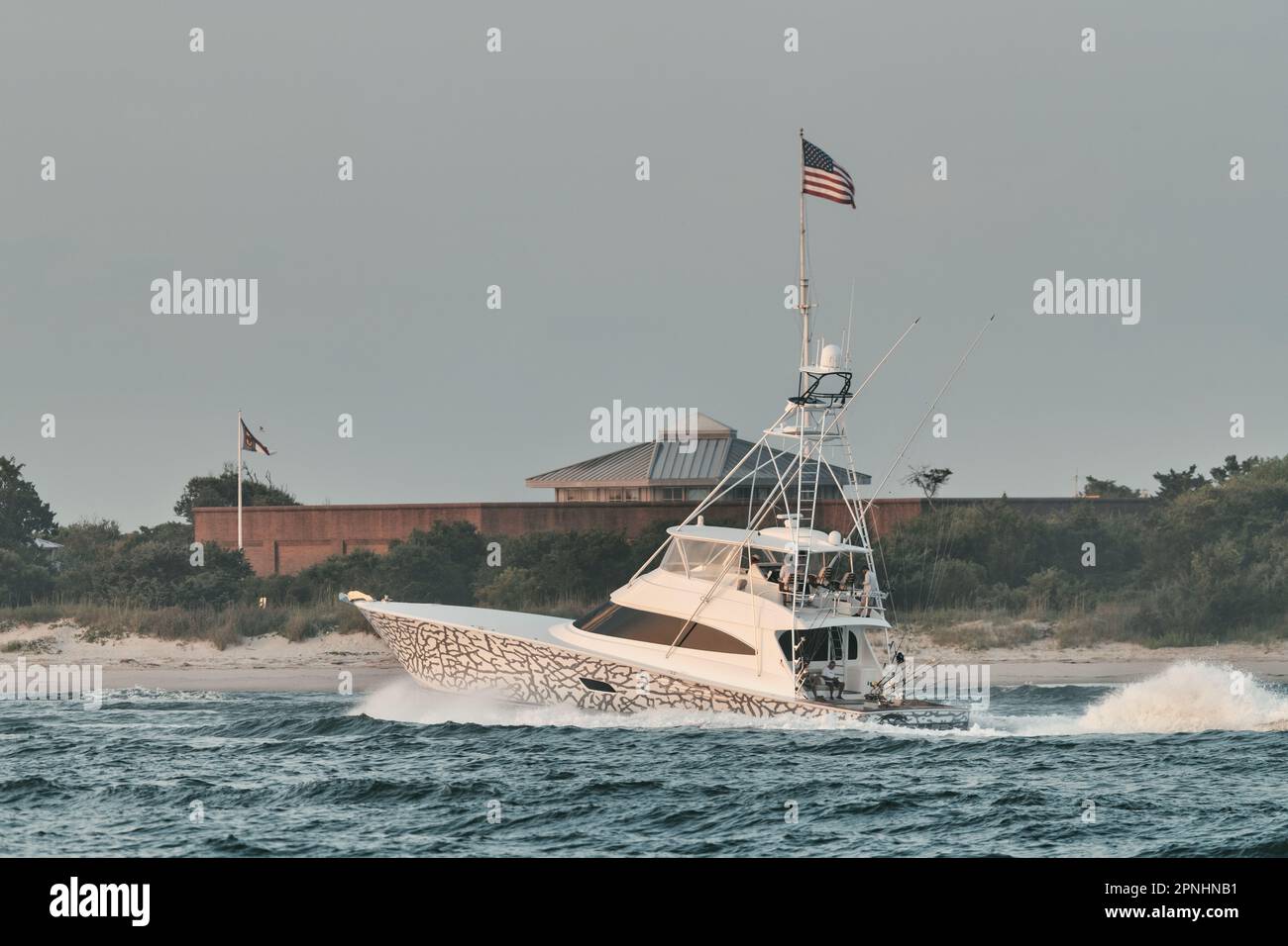 A large fishing vessel is seen navigating through the choppy waters of ...