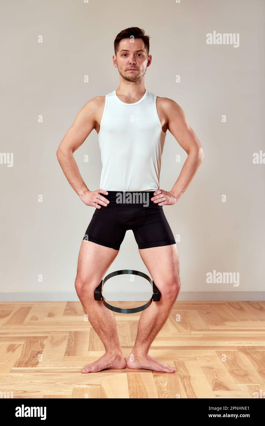 A man does exercises on a Pilates reformer, reformers for Pilates ...