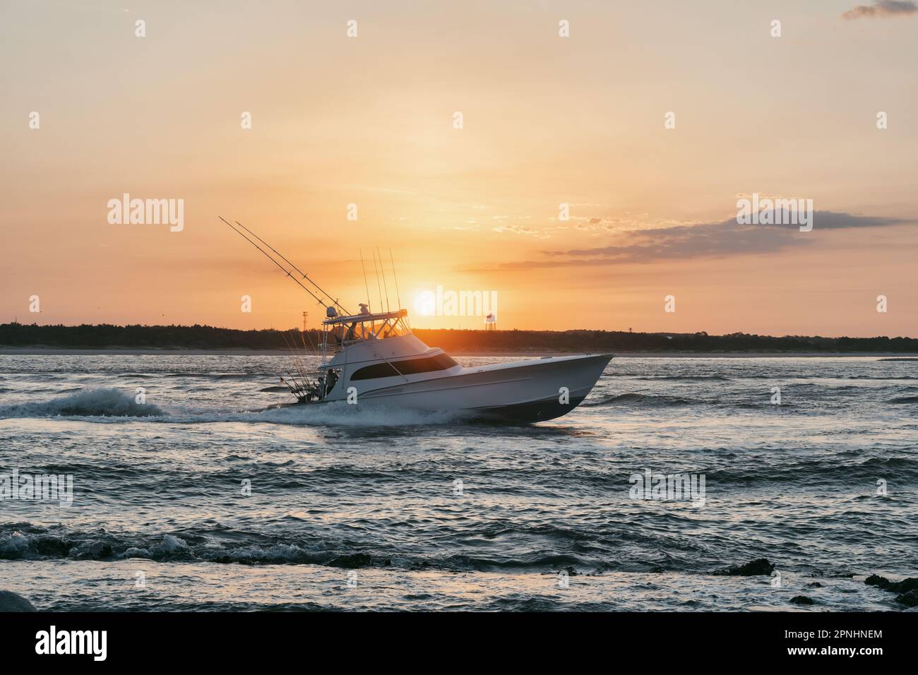 A large fishing vessel is seen navigating through the choppy waters of ...