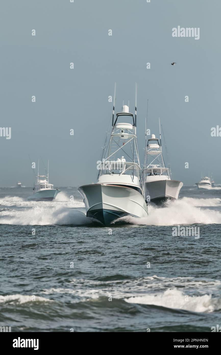 A large fishing vessel is seen navigating through the choppy waters of ...