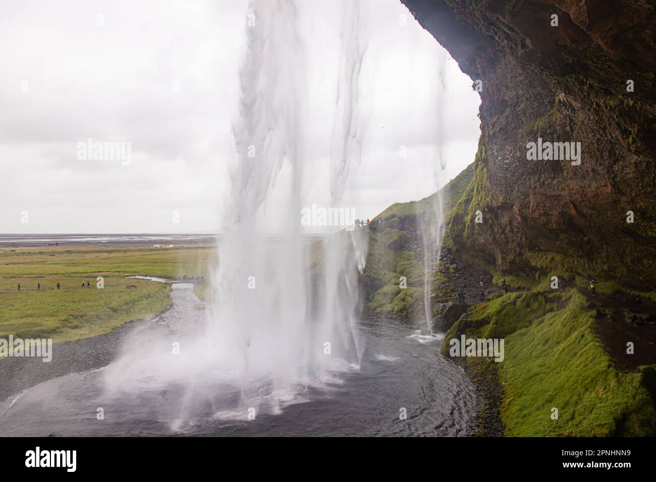 Seljalandsfoss waterfall in Iceland spraying and steaming while ...