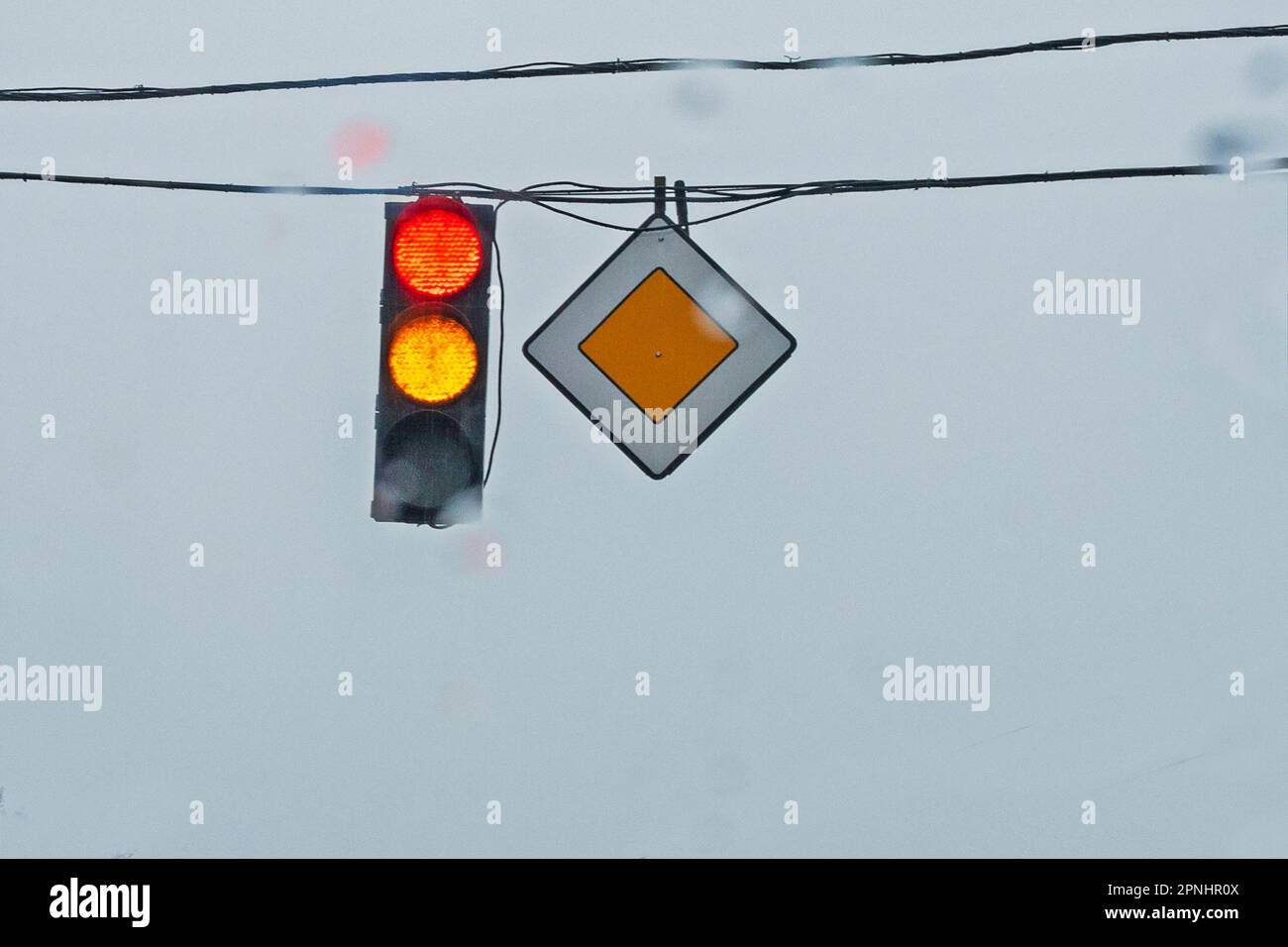 traffic lights with a pointer to the main road on a gray background in ...