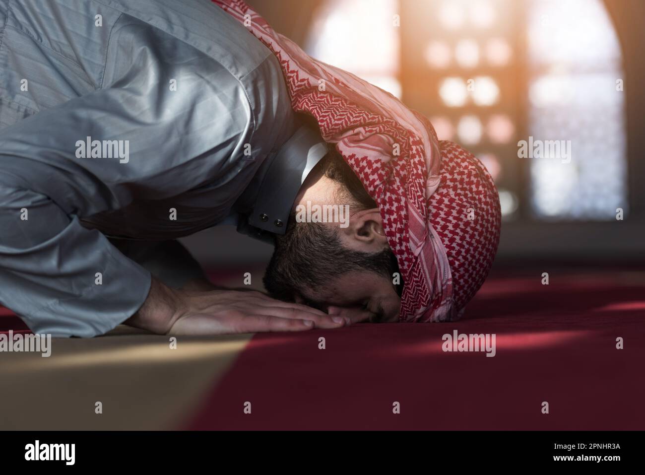 Arabic Muslim Man Making Traditional Prayer To God While Wearing ...