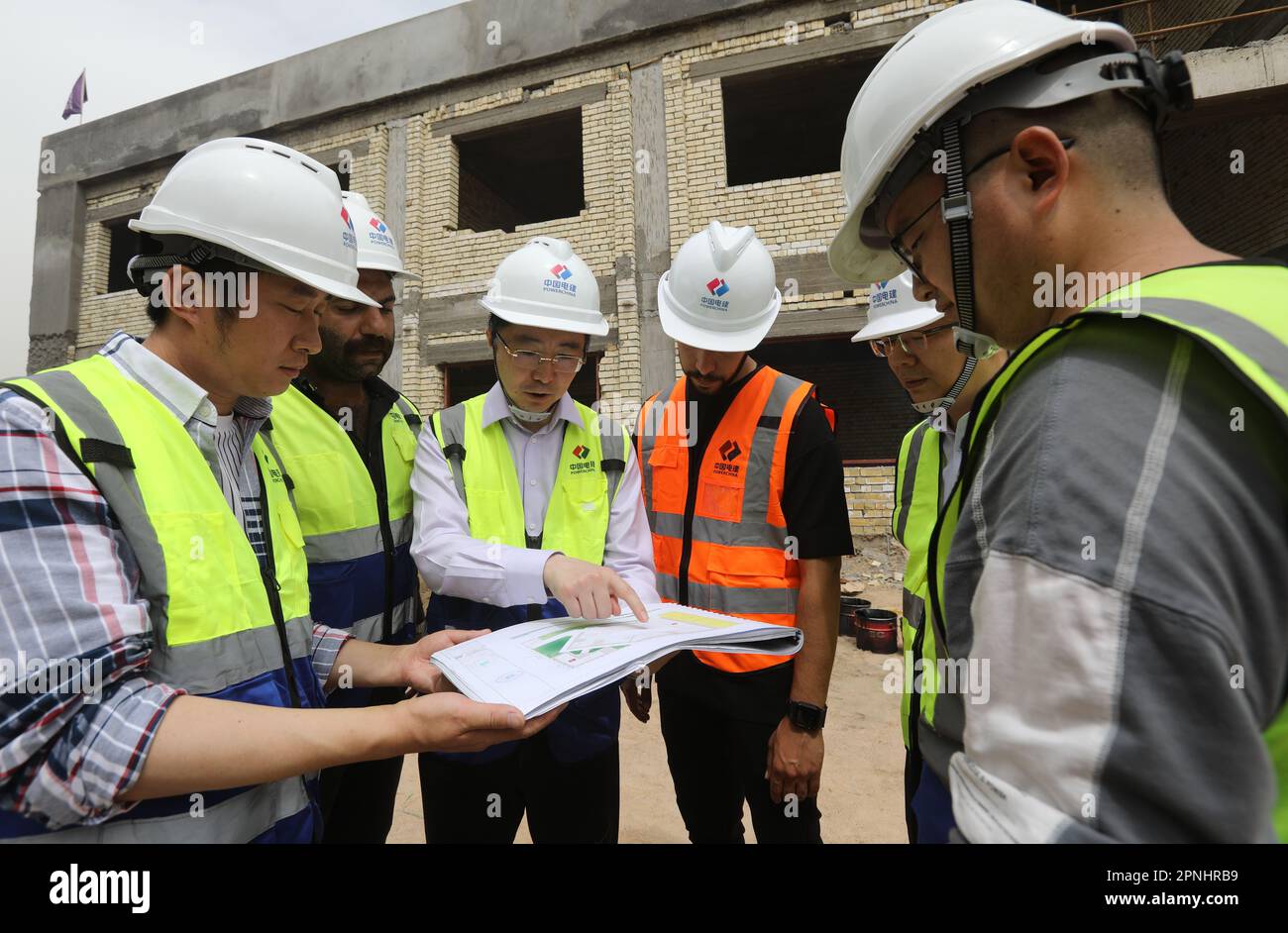 Baghdad, Iraq. 9th Apr, 2023. Chinese and Iraqi workers work at a ...