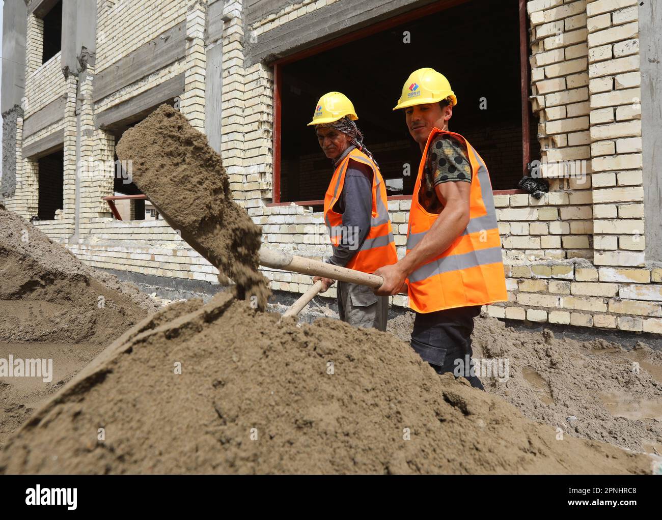 Baghdad, Iraq. 9th Apr, 2023. Iraqi workers work at a school being ...