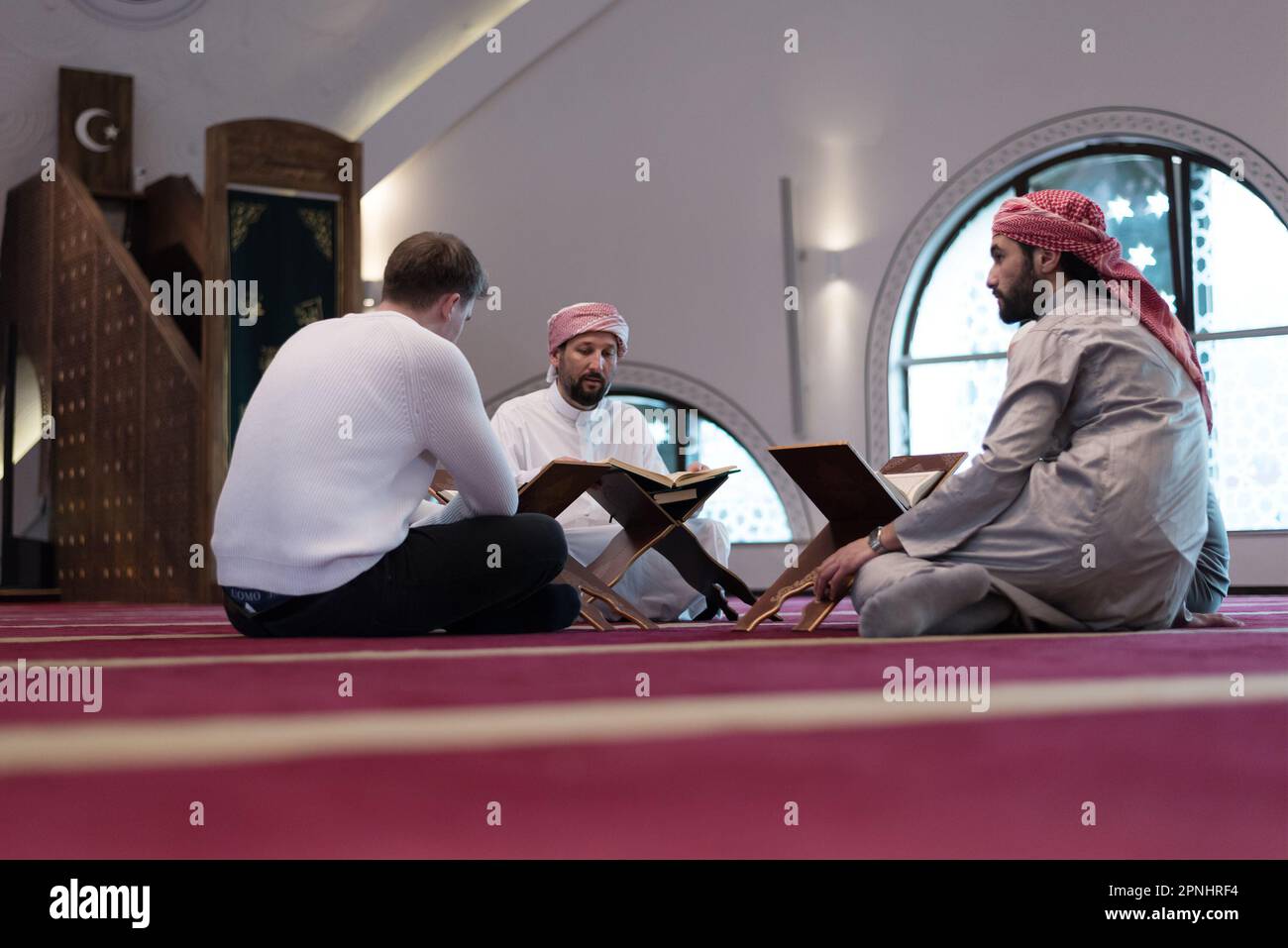 Read the Qur'an on the day of Ramadan. Group of Young Muslim people ...