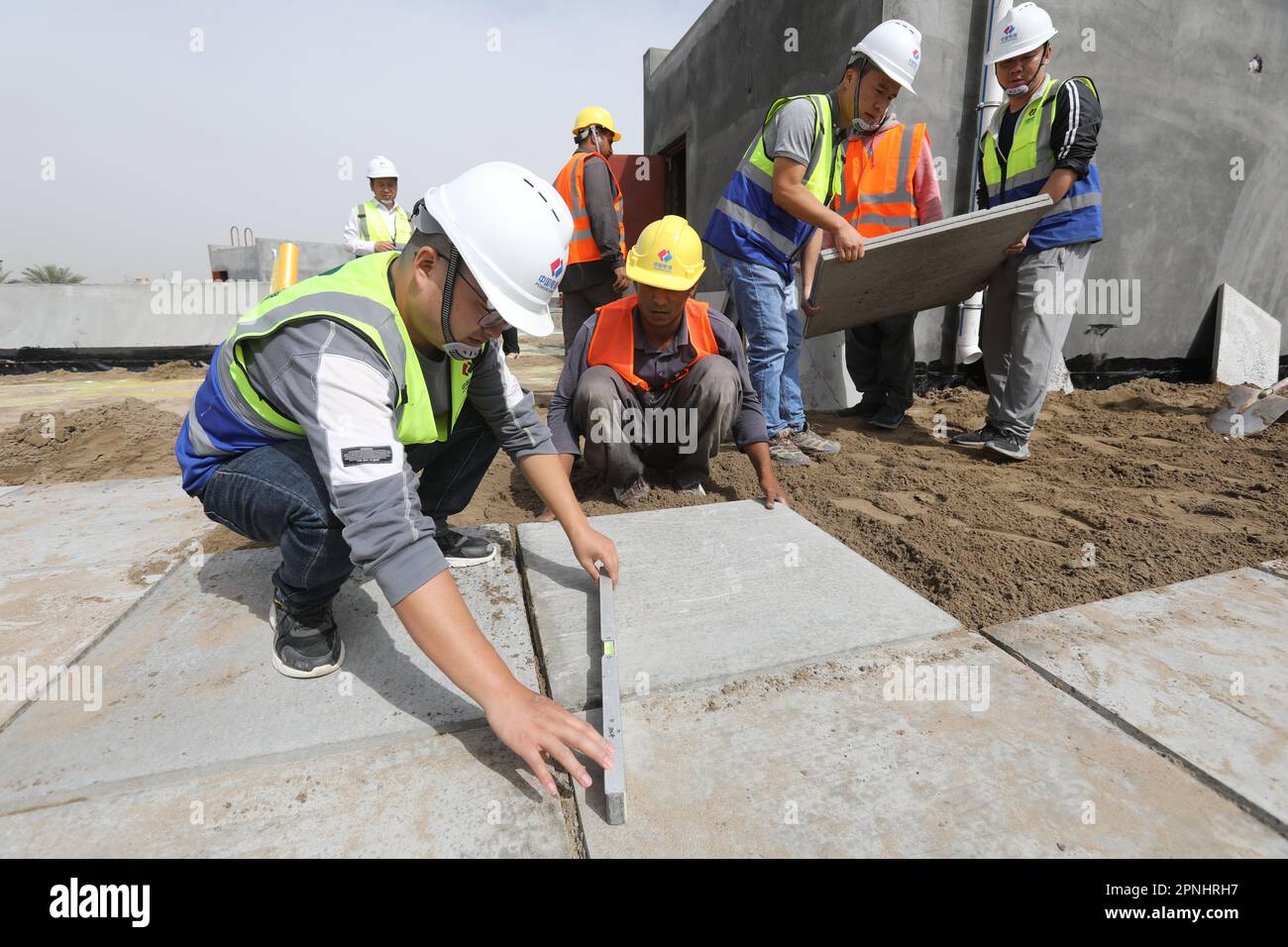 Baghdad, Iraq. 9th Apr, 2023. Chinese and Iraqi workers work at a ...