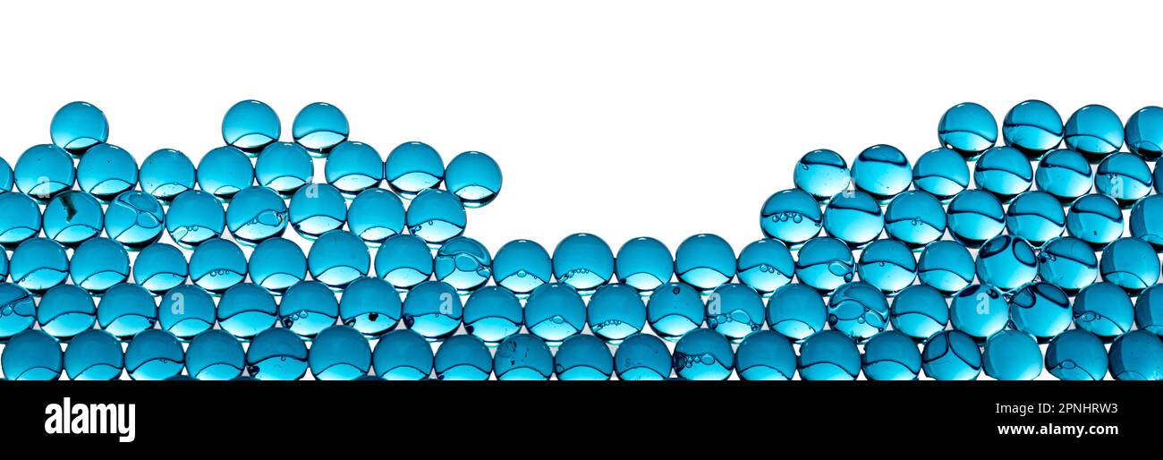 a heap of transparent shiny blue pearls for banner, panorama or border ...