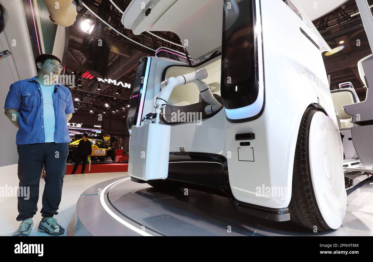 Shanghai. 18th Apr, 2023. A visitor looks at an autonomous vehicle of ...