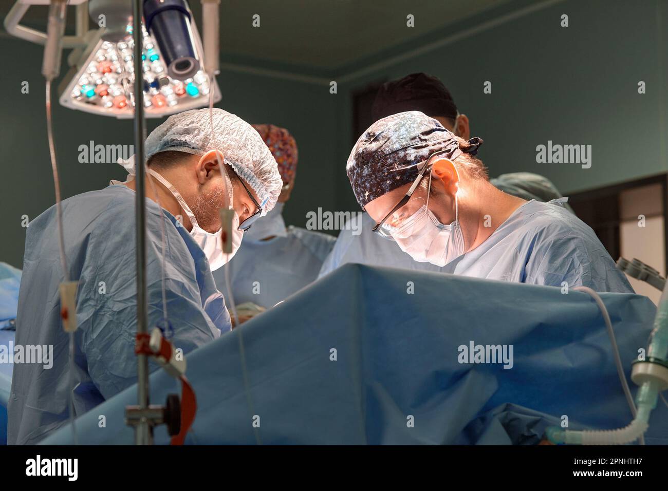 Surgeon face in operating room, stressful operation, surgeon performs ...