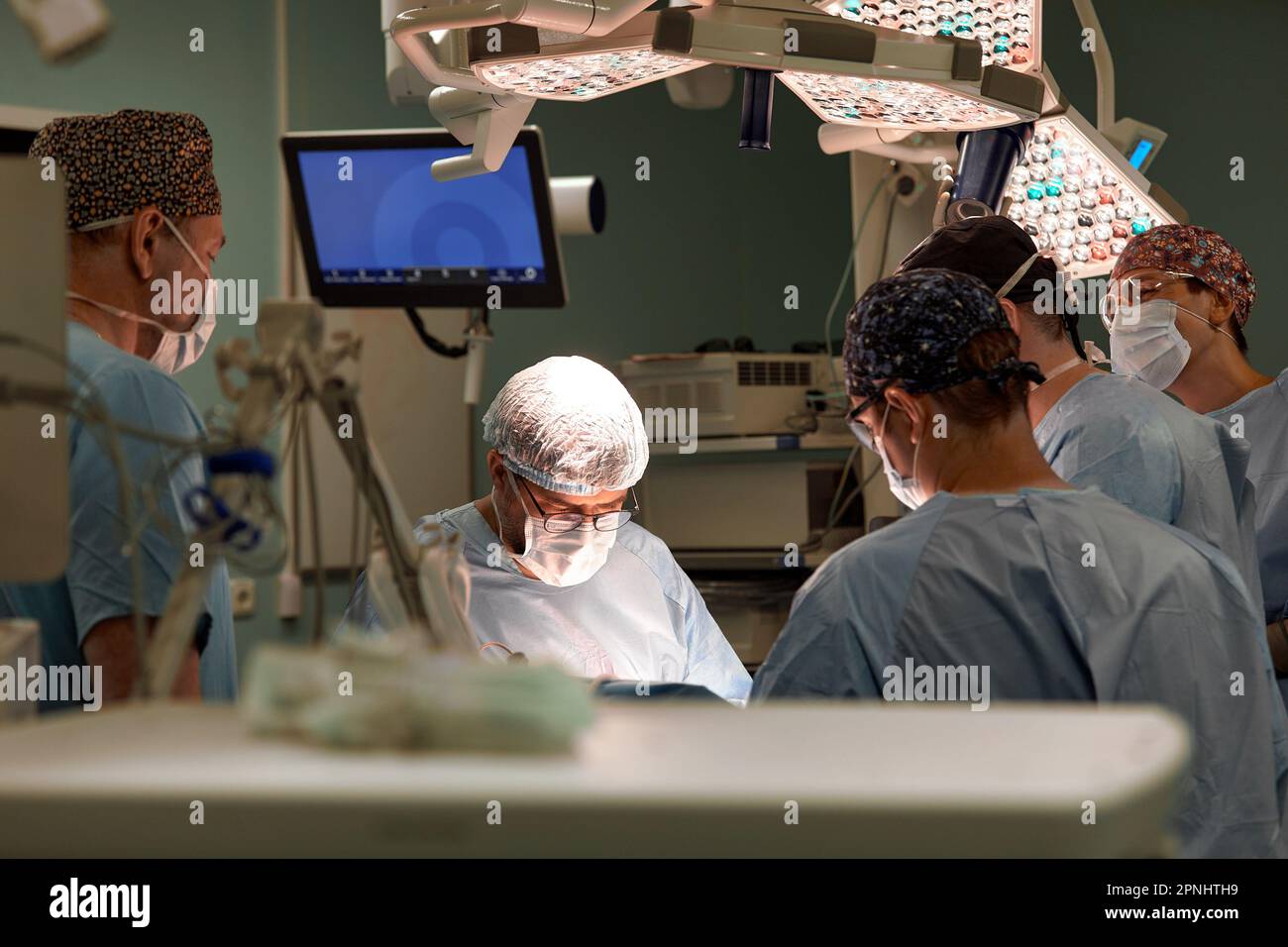 The faces of doctors surgeons in masks are a big plan, an operating ...