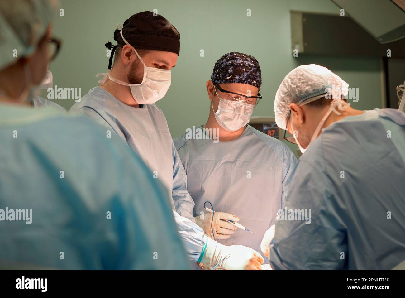 The faces of doctors surgeons in masks are a big plan, an operating ...