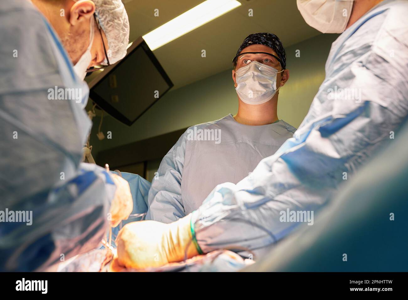Surgeon face in operating room, stressful operation, surgeon performs ...