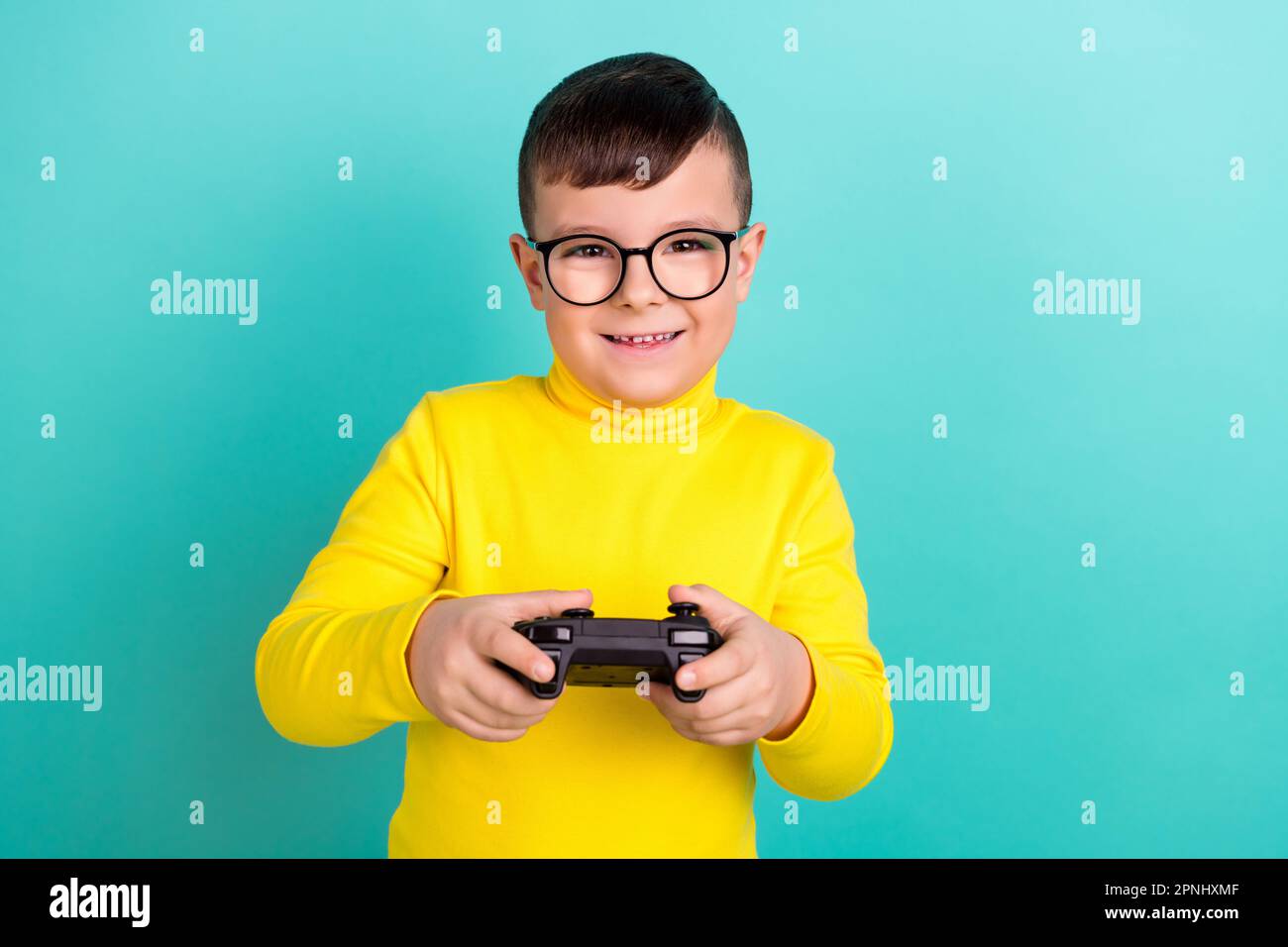 Photo of addicted boy playing video game with joy stick isolated on ...