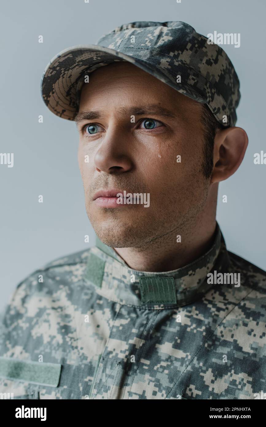 sad soldier in military uniform crying during memorial day isolated on ...