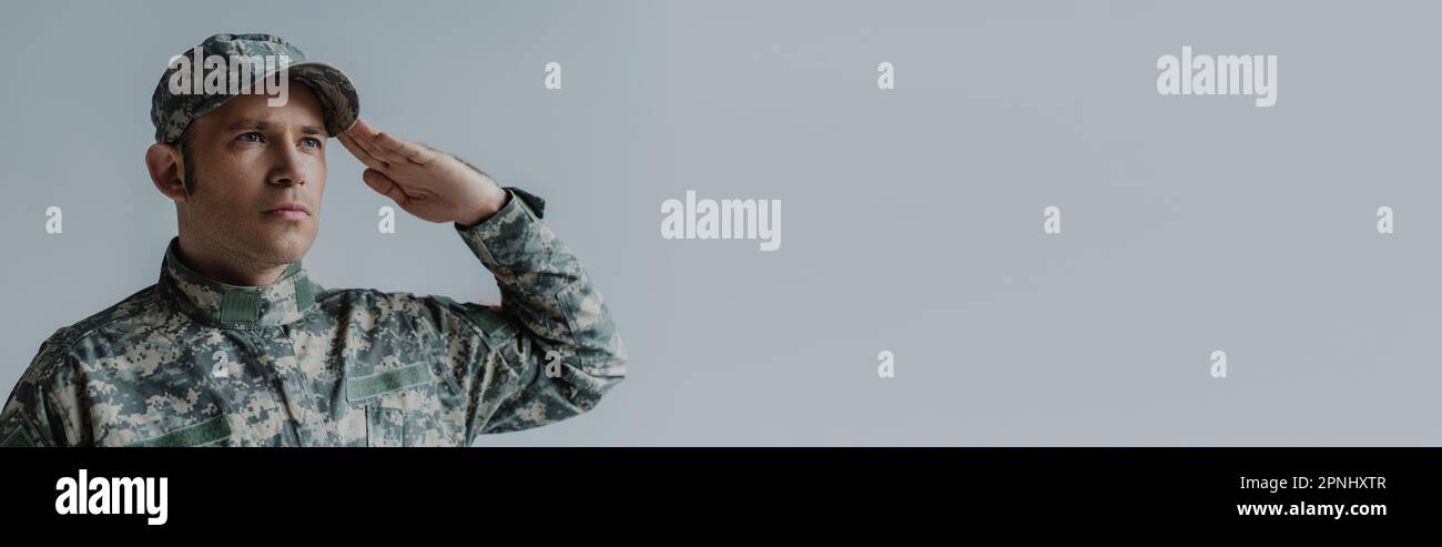 soldier in military uniform crying while saluting during memorial day ...