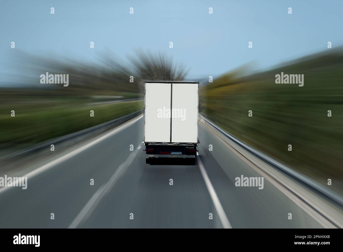 Truck on a highway - back view, zoom effect Stock Photo - Alamy