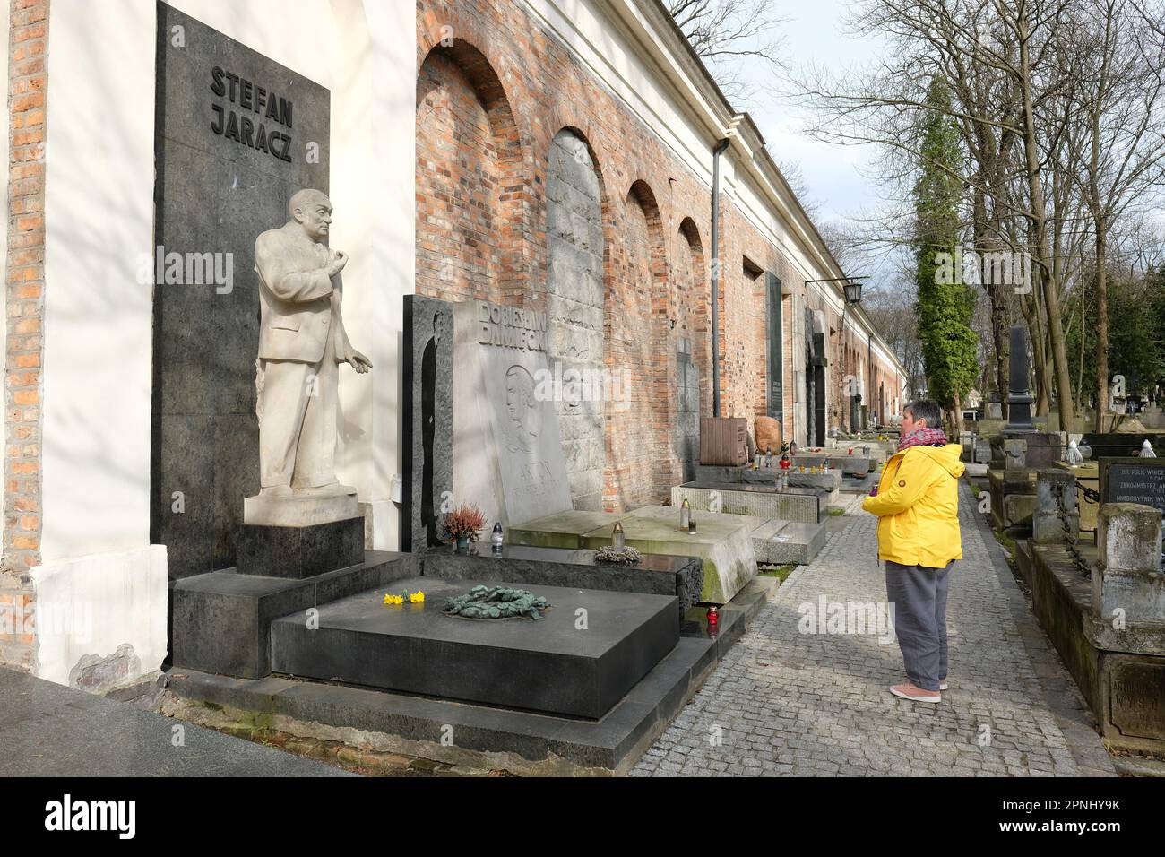 Warsaw Poland a visitor at the ornate Powazki cemetery which features ...